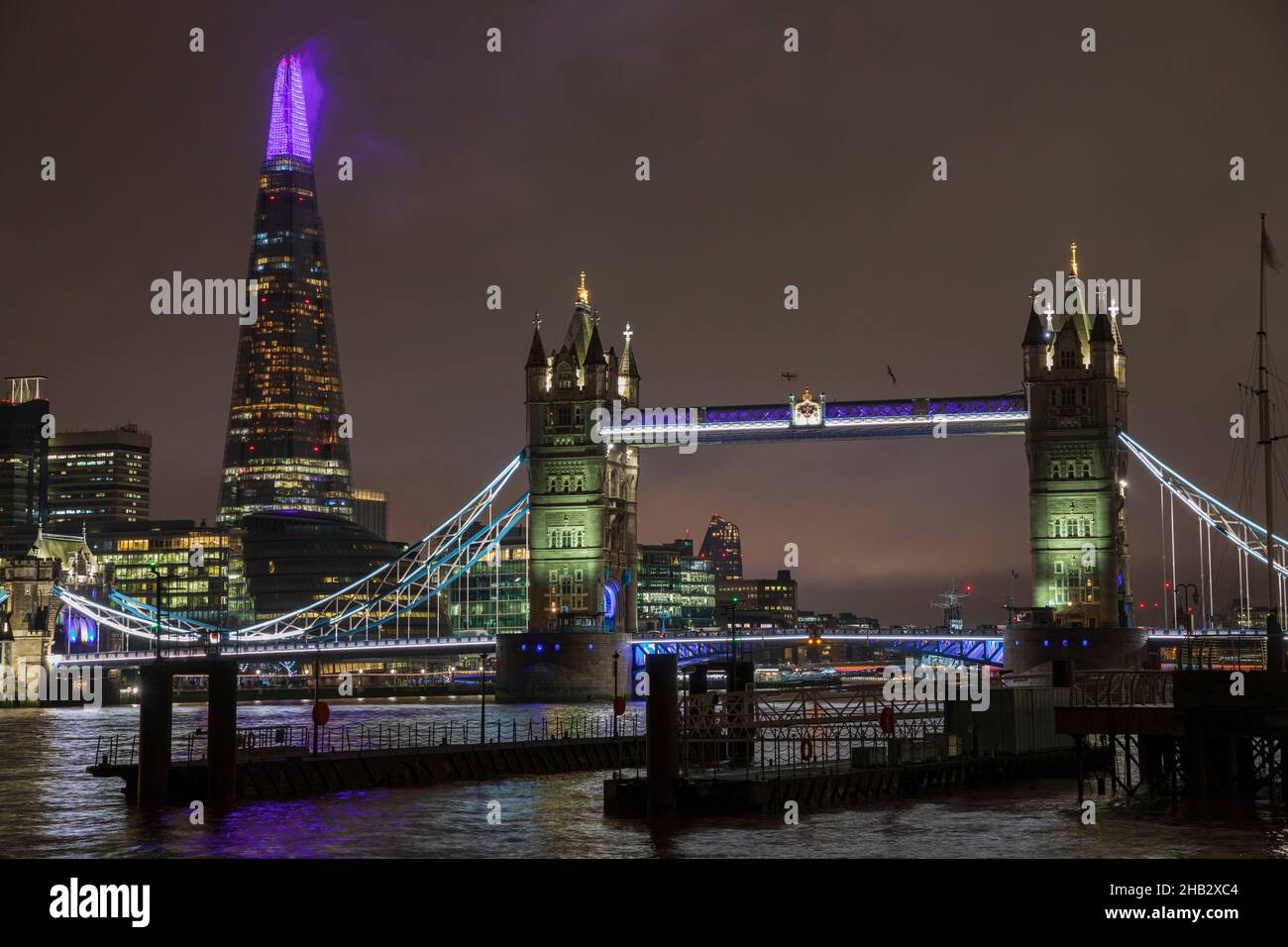 The Shard with special spire lights illuminating the London skyline and ...