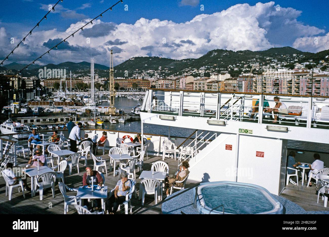 Passengers sitting on deck aboard Swan Hellenic cruise ship at Nice ...