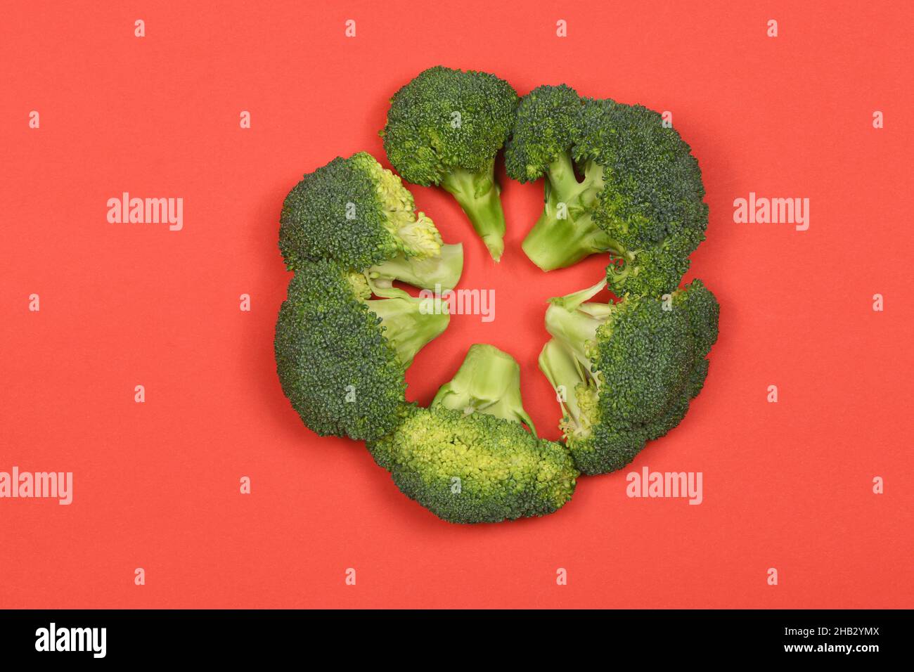 Broccoli isolated on red background. High resolution photo. Full depth ...
