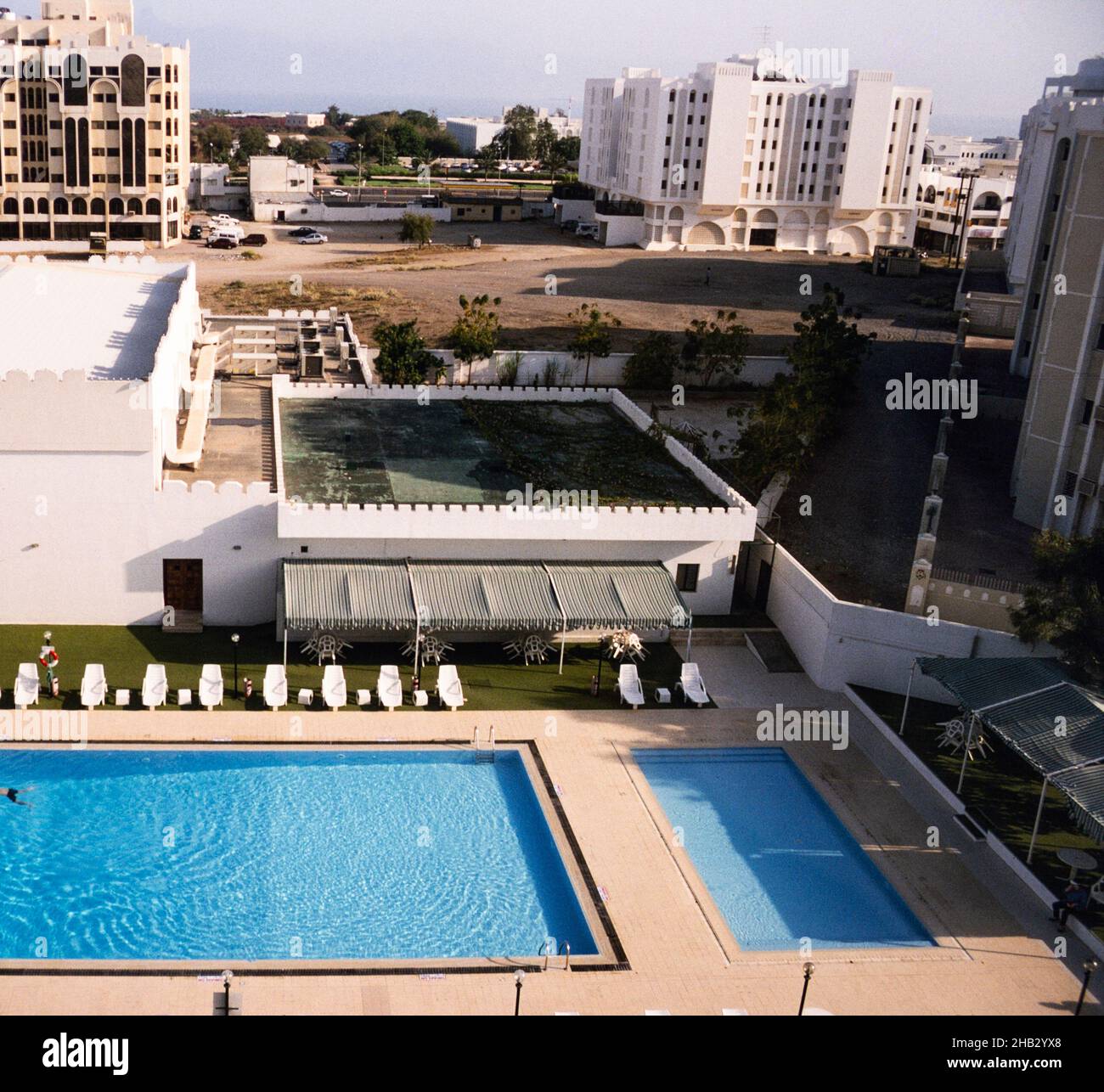 View over swimming pool from Holiday Inn hotel, Muscat, Oman 1998 Stock ...