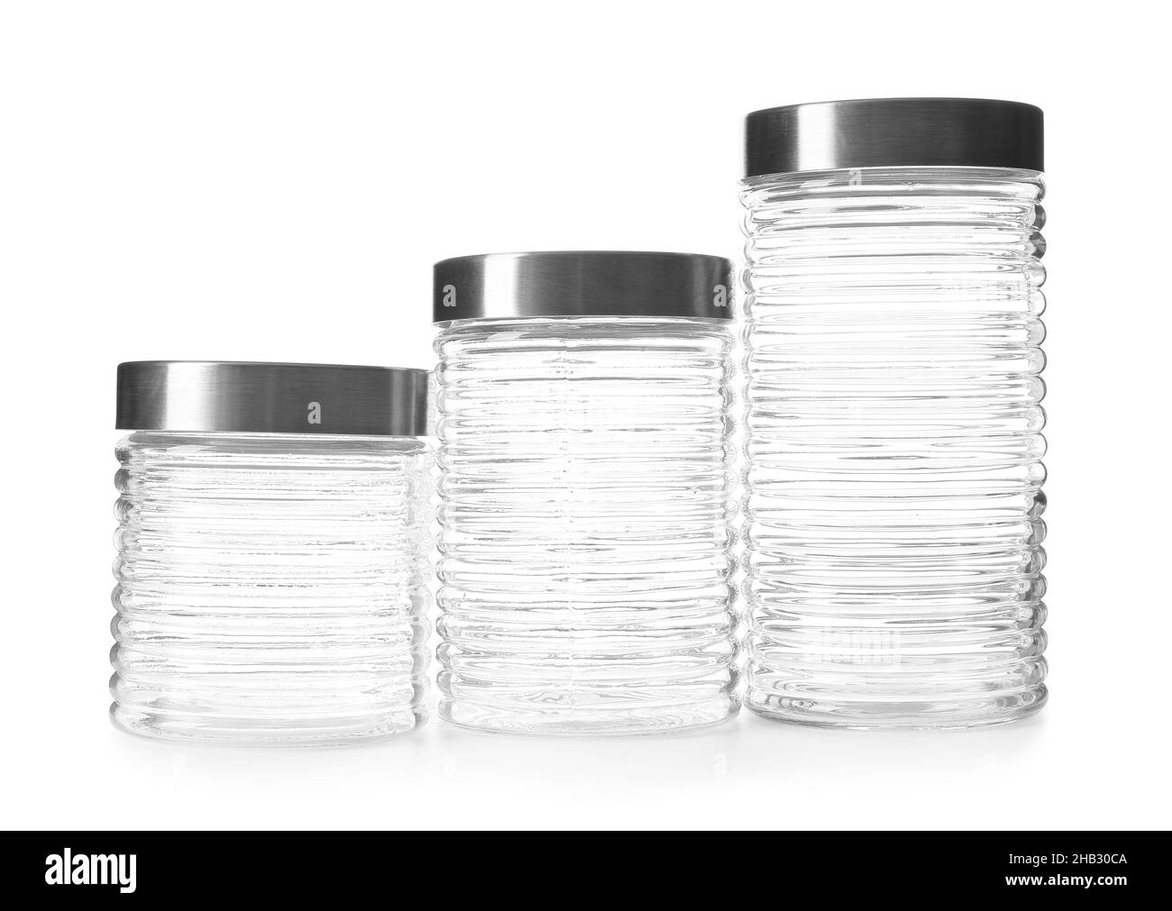 Three glass jars on white background Stock Photo - Alamy
