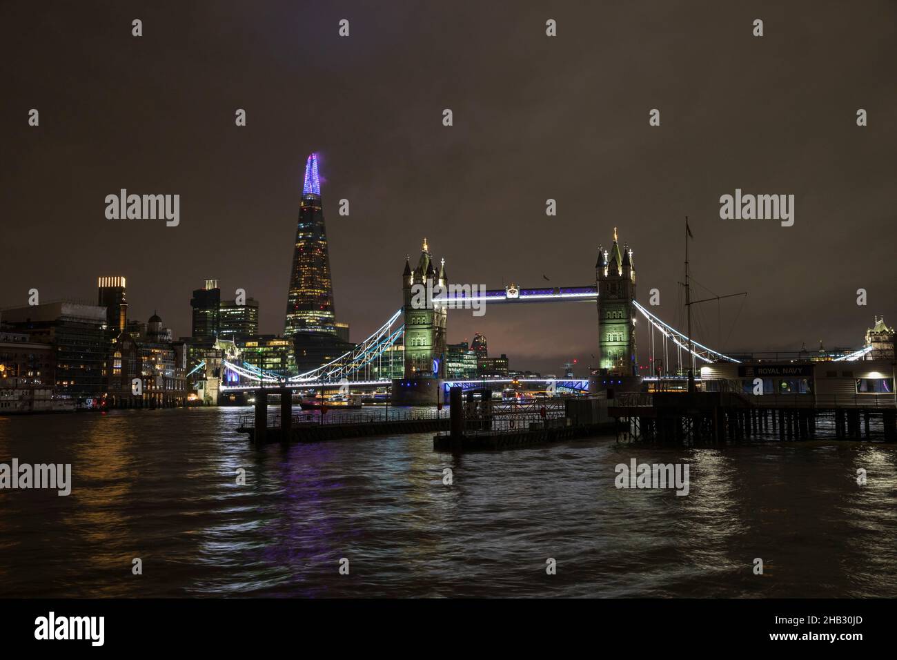 The Shard with special spire lights illuminating the London skyline and ...