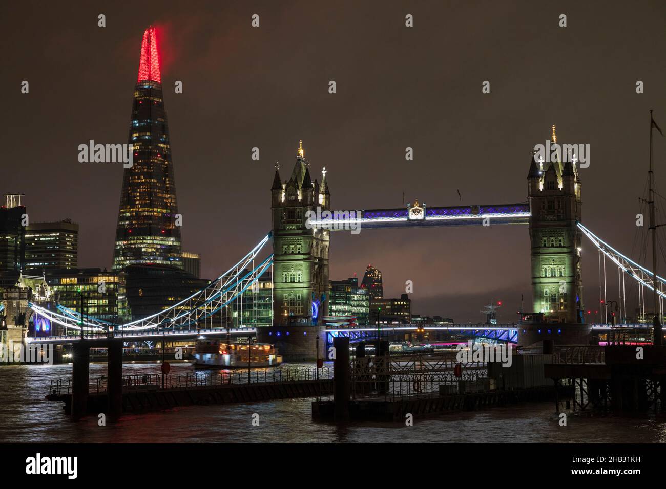The Shard with special spire lights illuminating the London skyline and ...