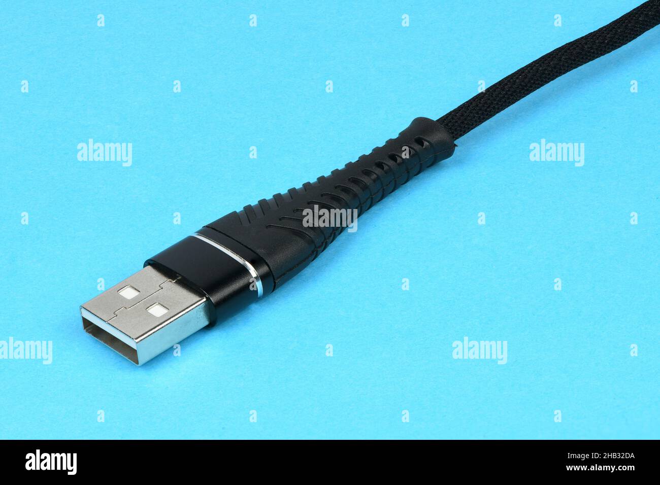 Closeup of an USB connector isolated on blue. High resolution photo ...