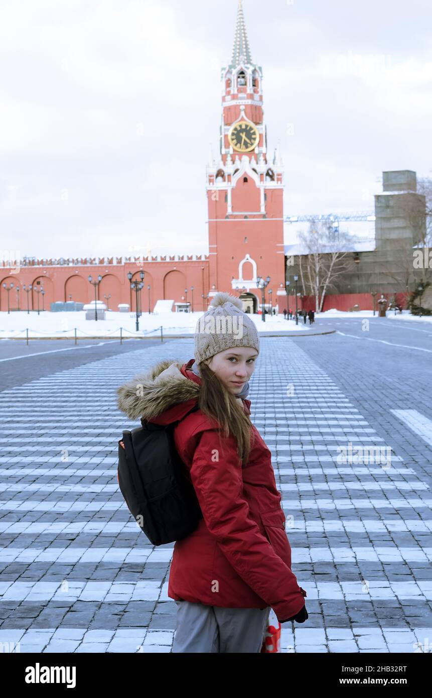 tourist girl on Red Square near Spasskaya Tower, Kremlin, Moscow city ...