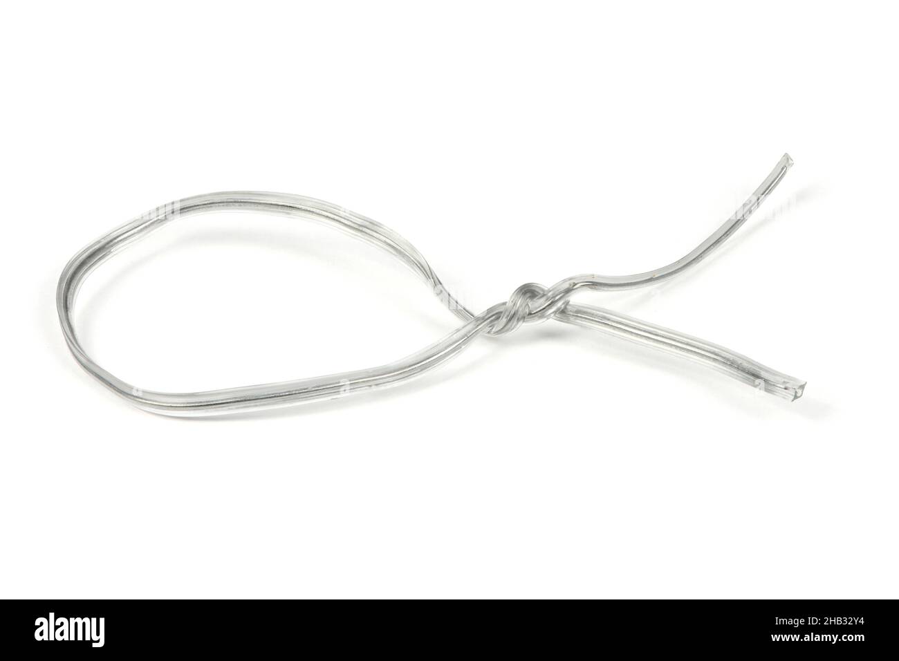 White plastic coated wire tie used for a variety of things on white ...