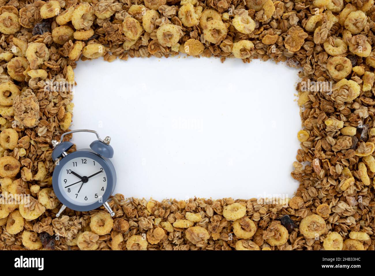 frame of homemade granola with clock and copy space for text isolated ...