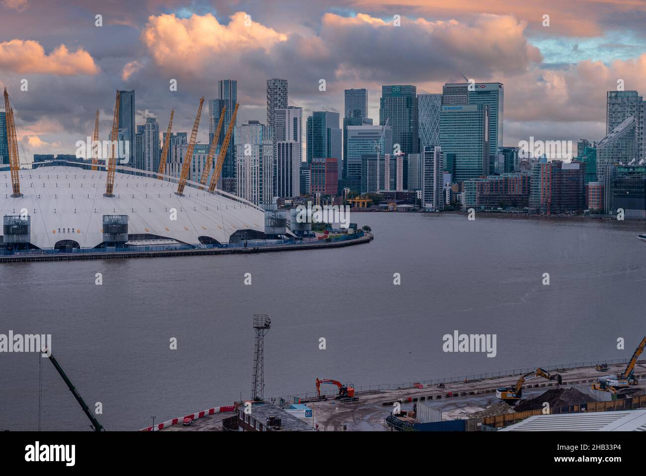 View from the river Thames over Millennium dome or O2 Arena in London ...
