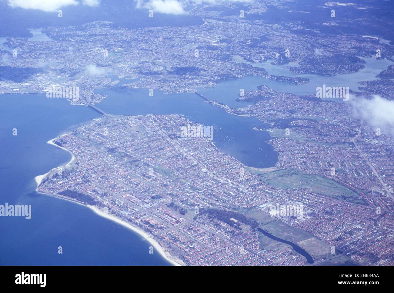 Aerial oblique view suburban housing area Georges River, Botany Bay ...