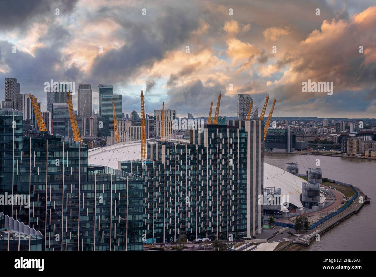 View from the river Thames over Millennium dome or O2 Arena in London ...