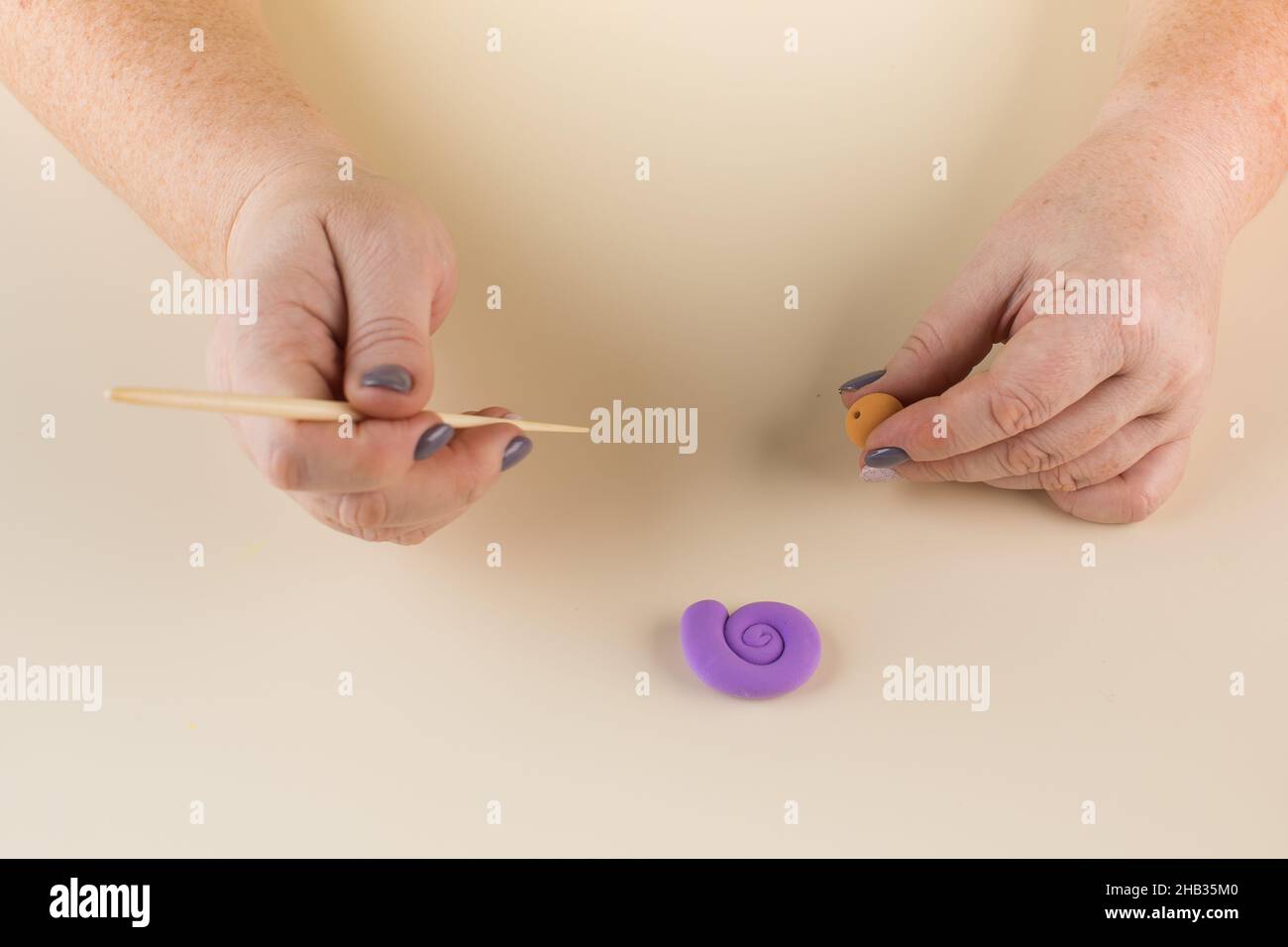 A snail made of polymer clay. Step-by-step instruction. Step 5 Roll up ...