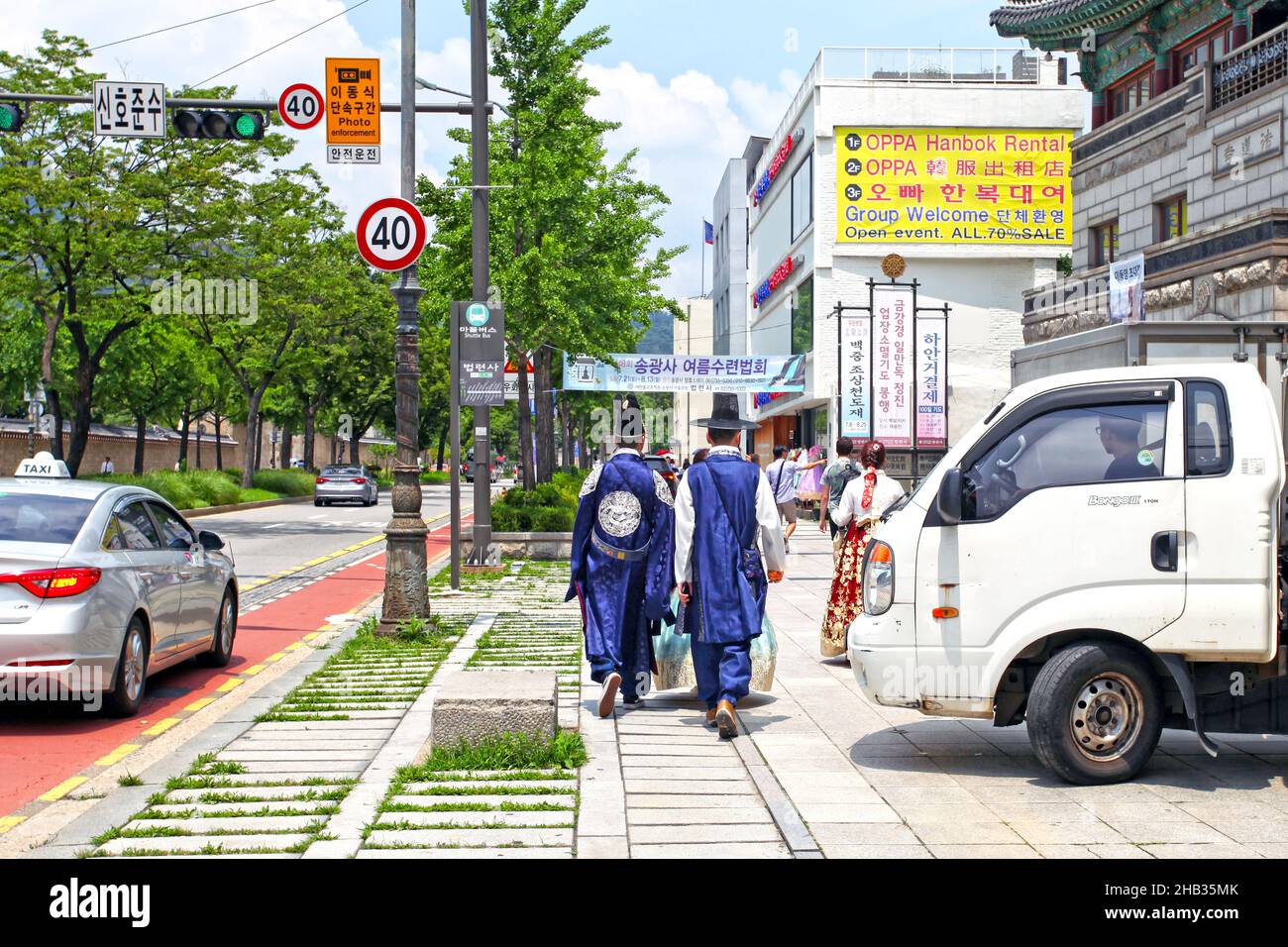 People dressed in Hanbok traditional costumes nearby the Gyeongbokgung ...