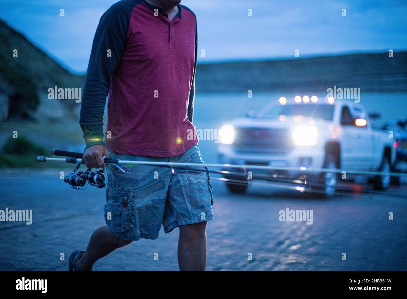 Getting ready to fish at sunrise Stock Photo - Alamy