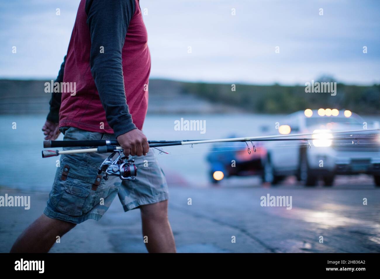 Getting ready to fish at sunrise Stock Photo - Alamy