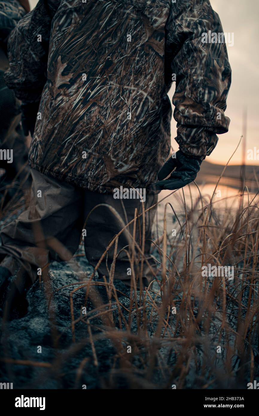 Duck Hunter wading in pond Stock Photo - Alamy