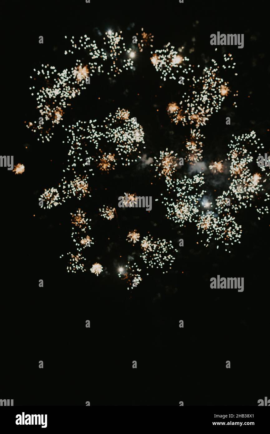 Vertical shot of colorful fireworks on a night sky background Stock ...