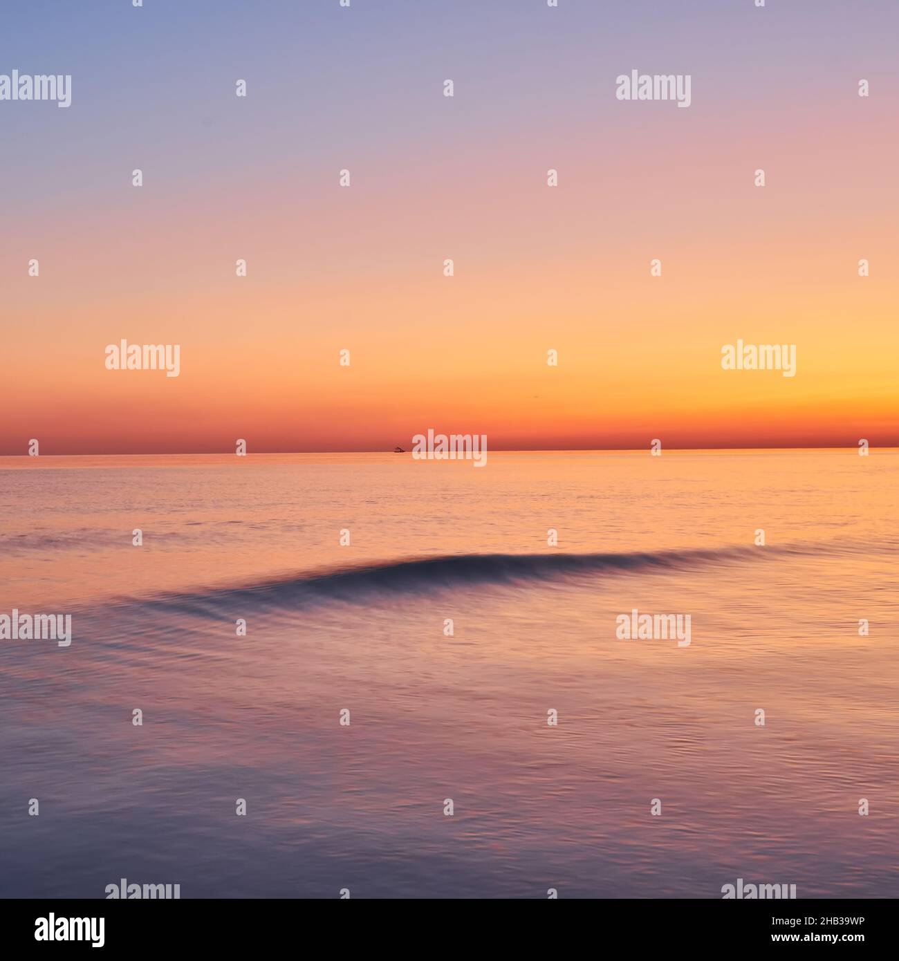 Vivid twilight sunset sky and motion blur of the sea under with long ...