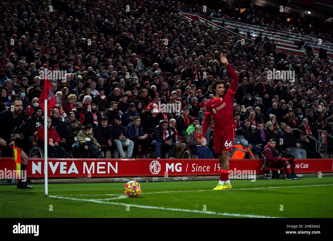 Liverpool fans in the stands look on as Trent Alexander-Arnold takes a ...