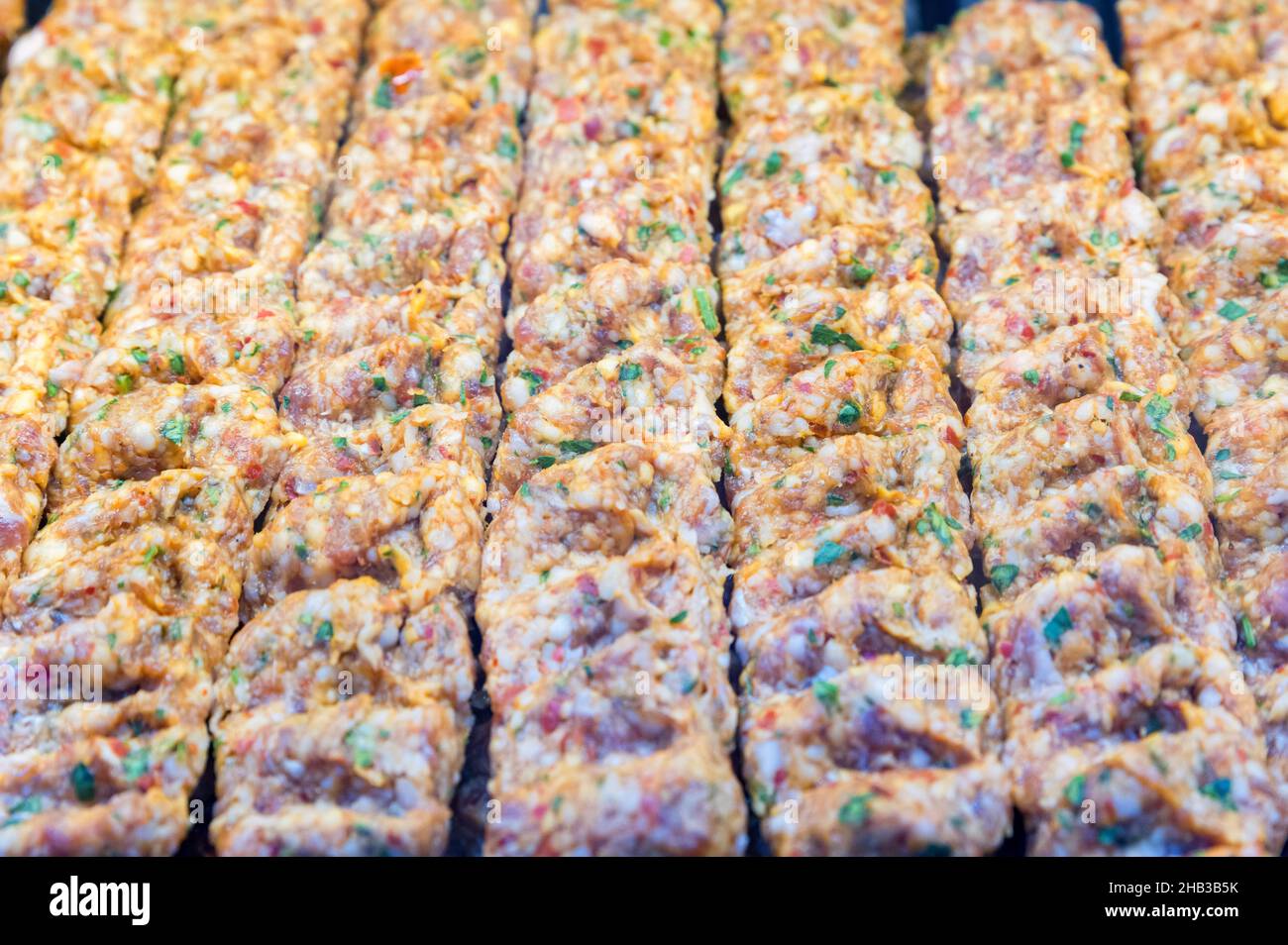 Cooking meat turkish barbecue dish named kofta using skewers on mangal ...