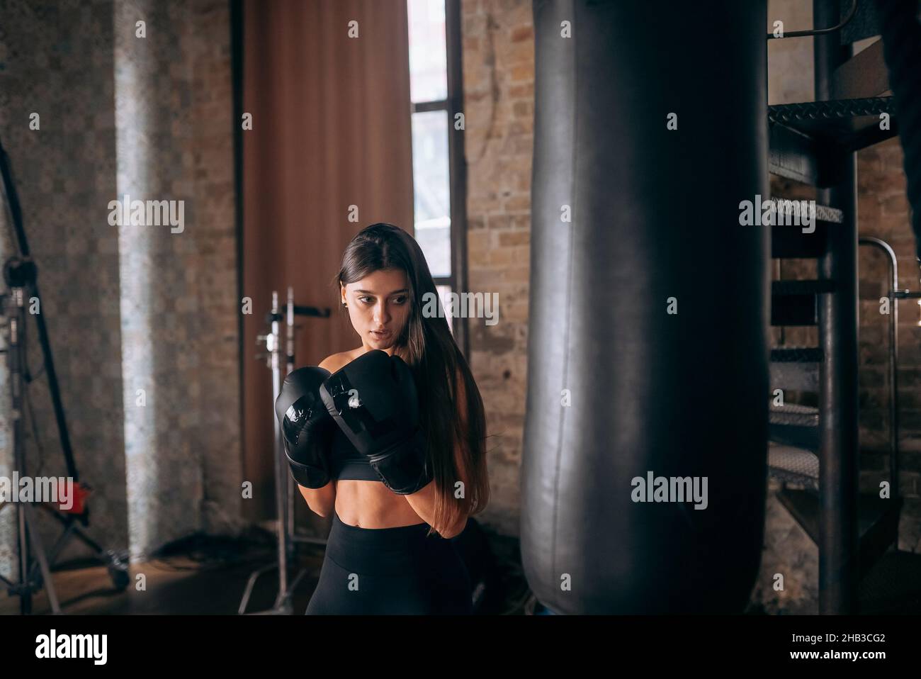 Young woman boxing workout at the gym Stock Photo - Alamy