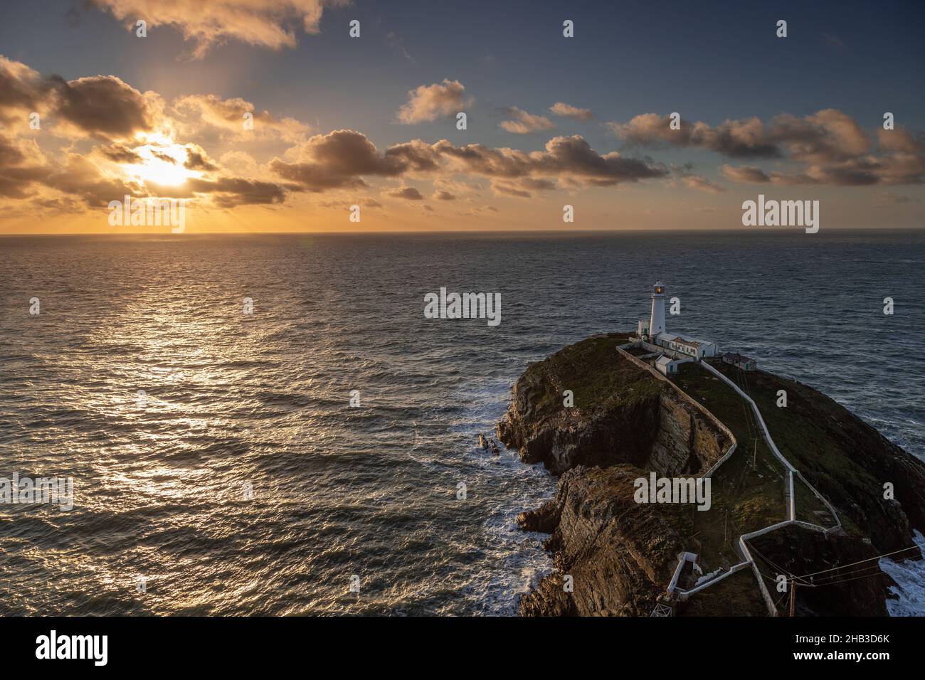 Sunset over South Stack lighthouse, Anglesey, North Wales Stock Photo ...