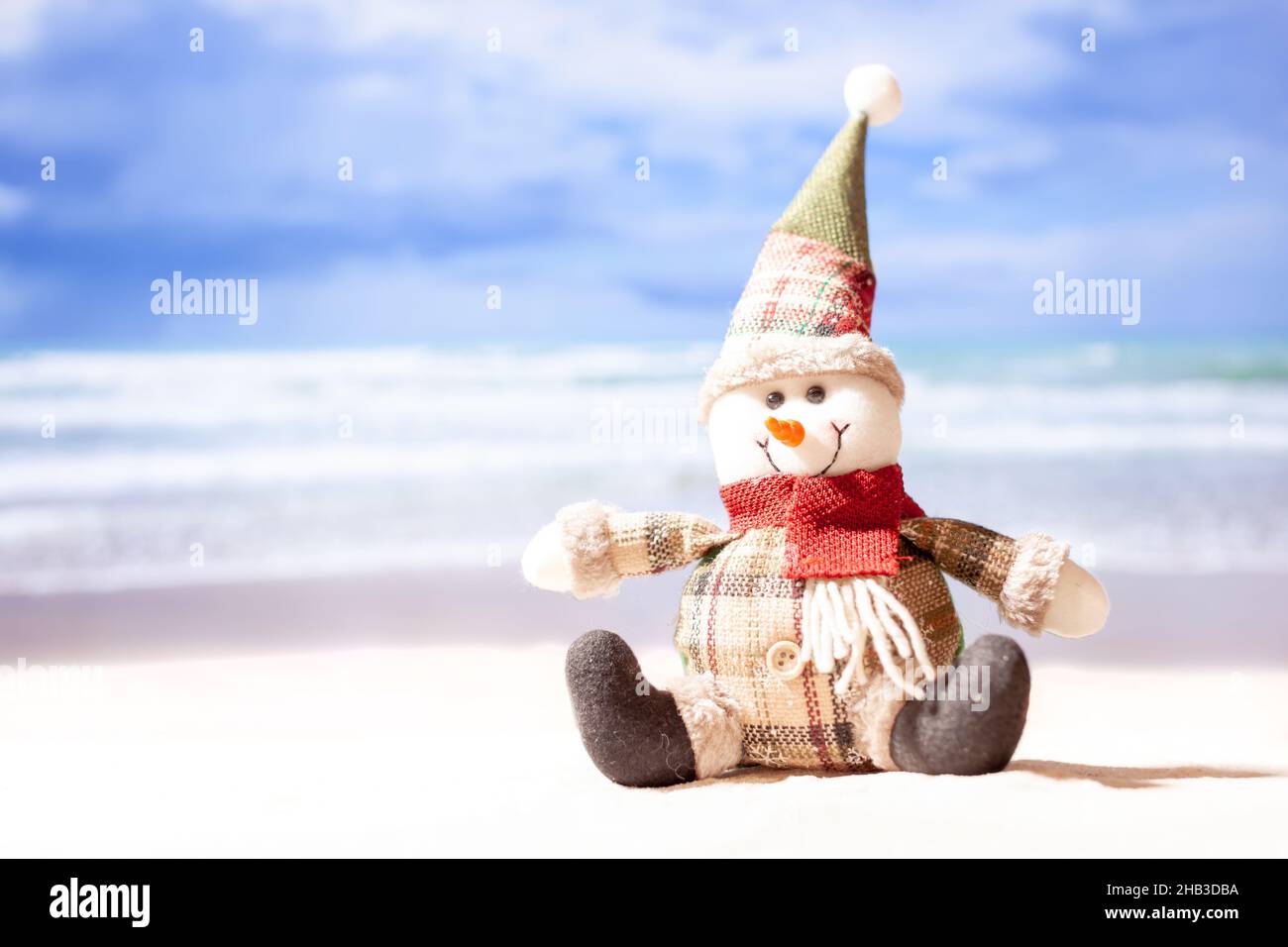 New year on the beach. Christmas snowman on the beach on the background ...