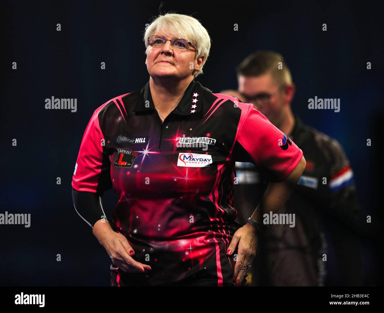 Lisa Ashton walks off stage after losing a set to Ron Meulenkamp during ...
