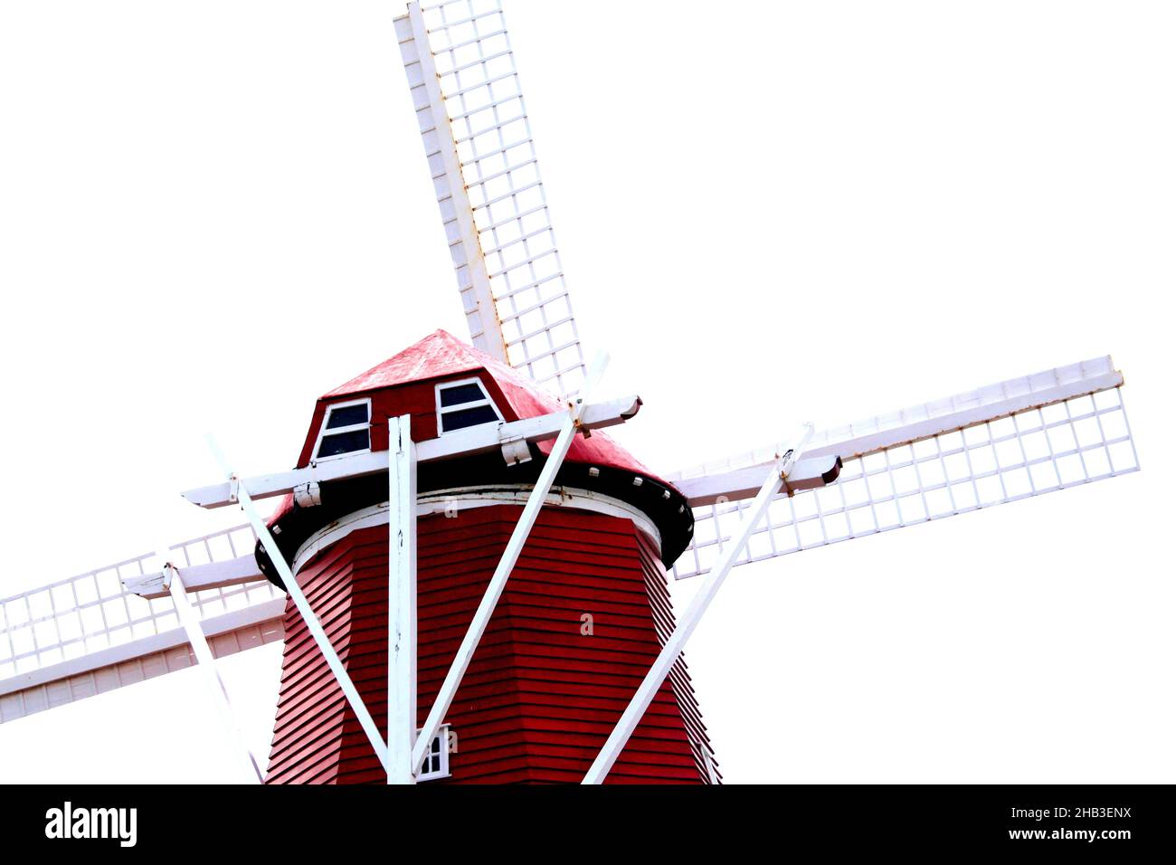 Red windmill with white blades under the white sky Stock Photo - Alamy