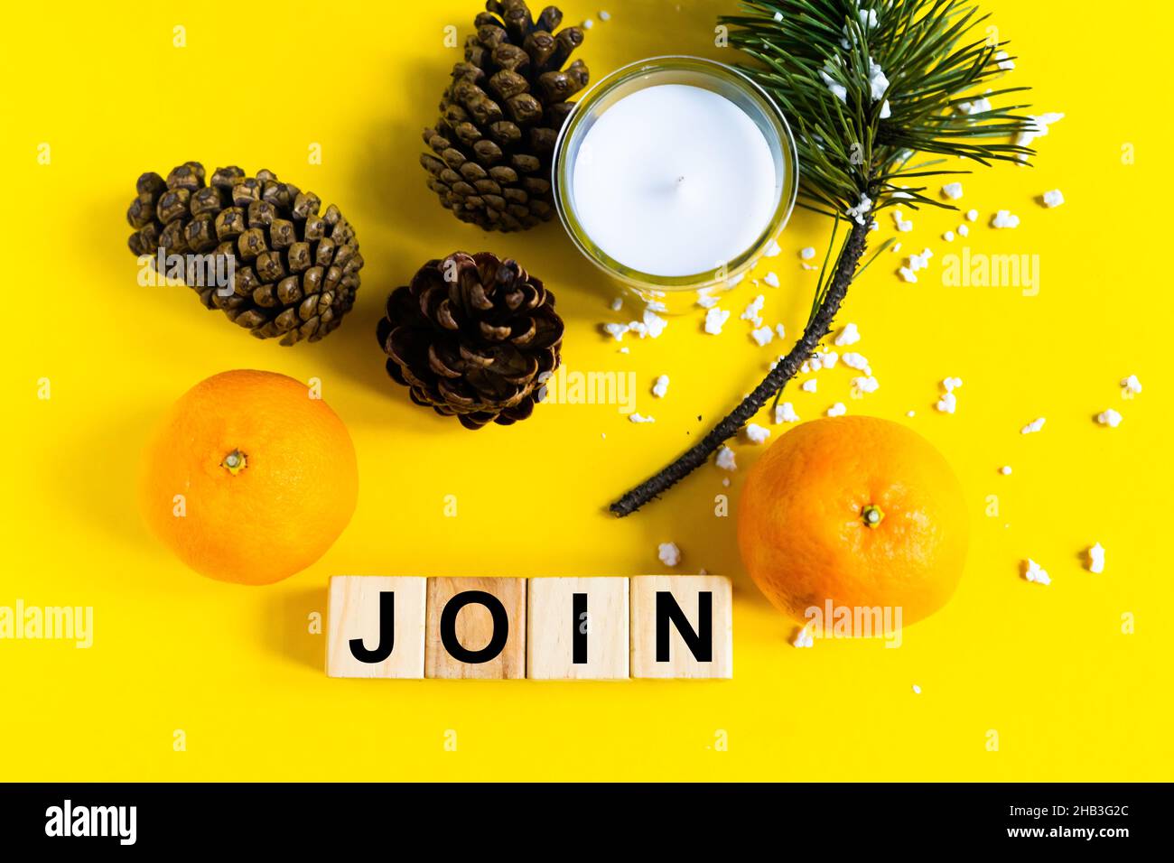 Word JOIN on wooden blocks on a yellow background with tangerine ...