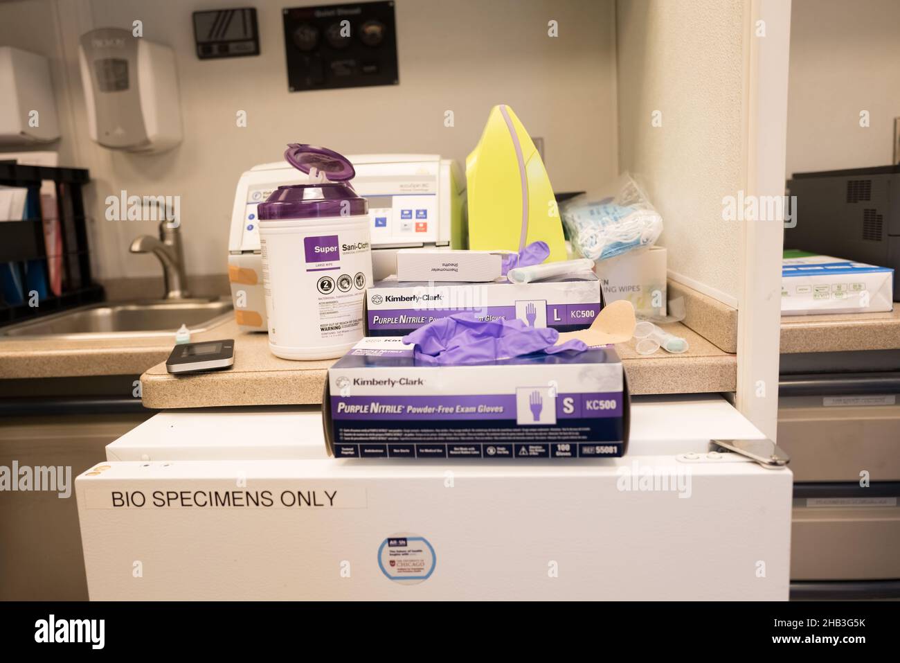 Laboratory space showing boxes of purple Kimberly-Clark disposable ...