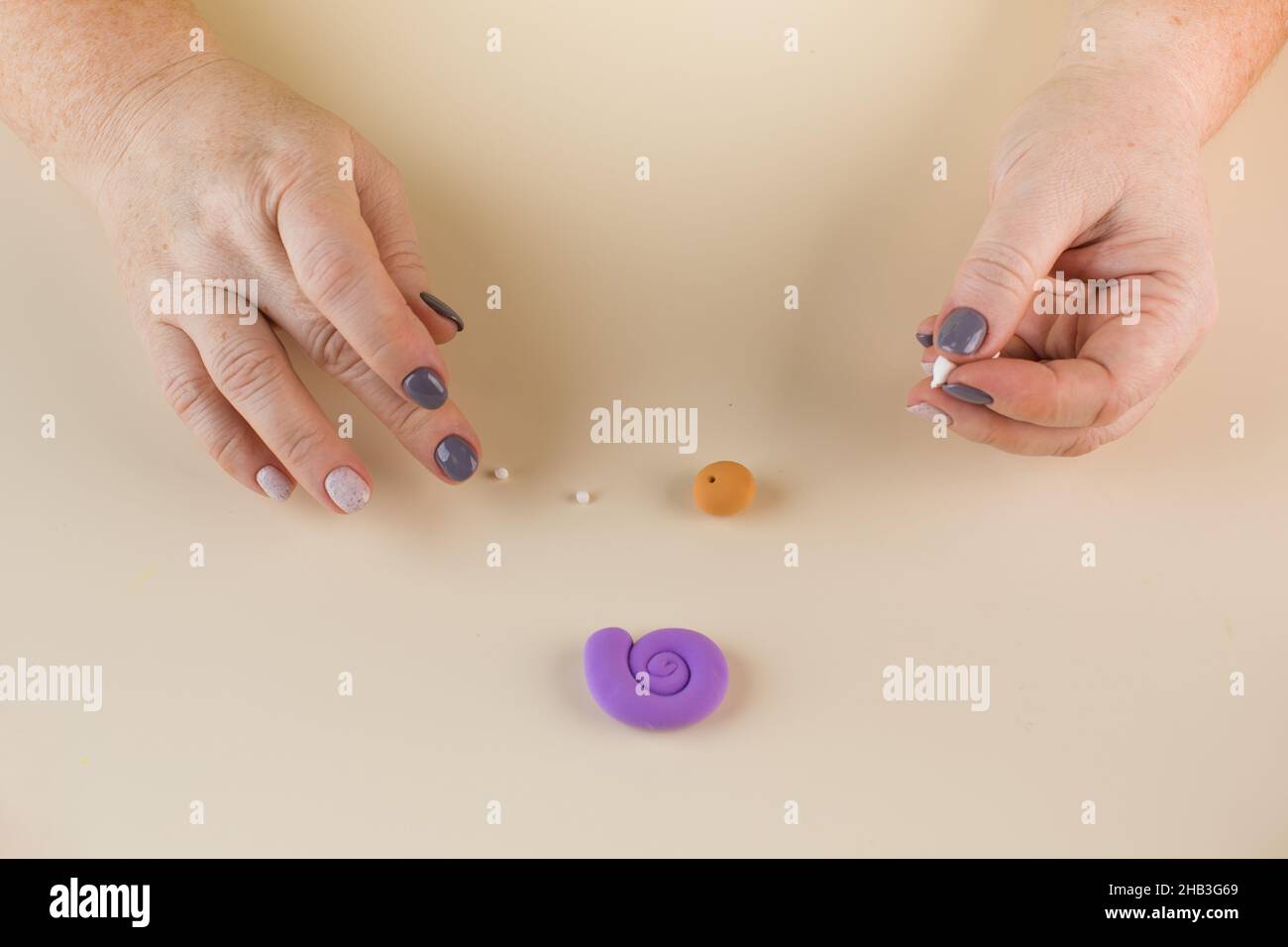 A snail made of polymer clay. Step-by-step instruction. Step 6 Roll up ...