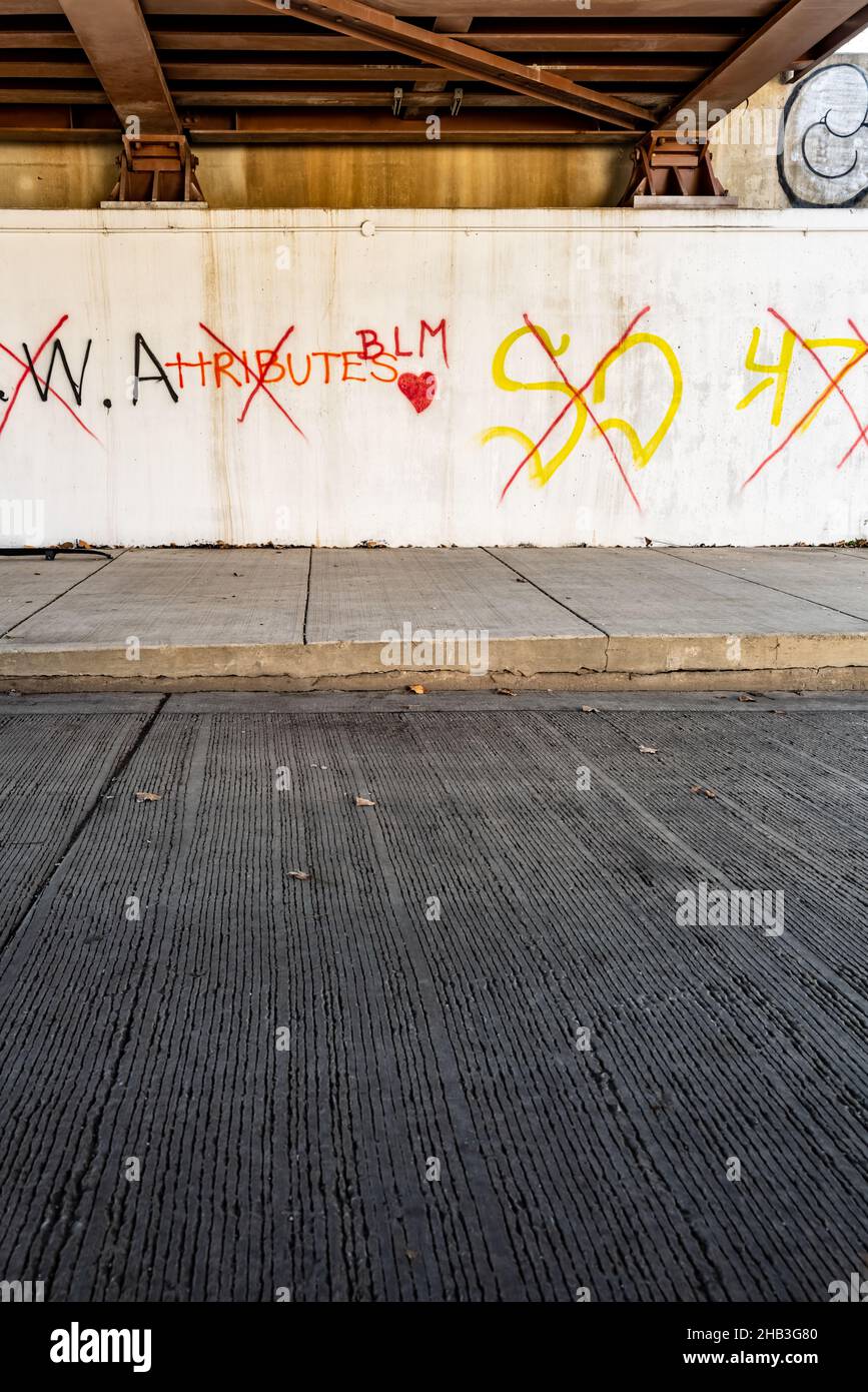 White wall with various graffiti where the original graffiti of NWA and ...