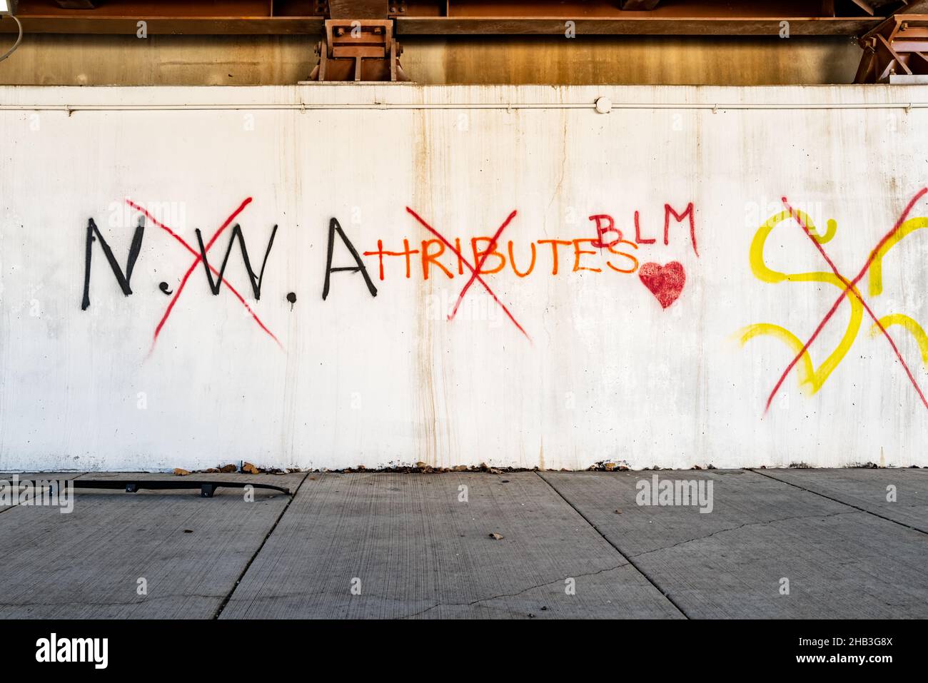 White wall with various graffiti where the original graffiti of NWA and ...