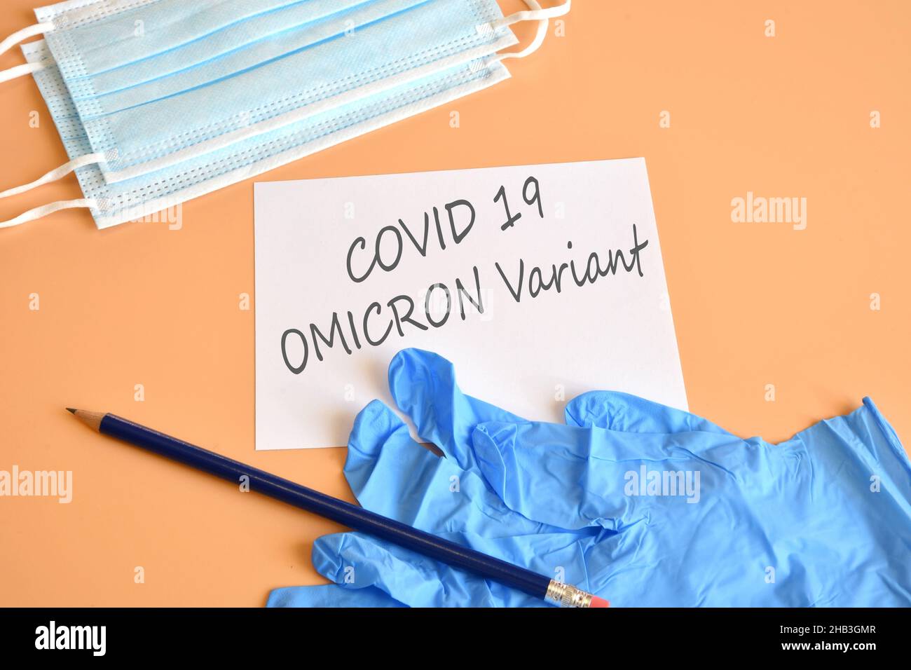 Covid-19 new Omicron variant. Medical face masks, blue medical gloves ...