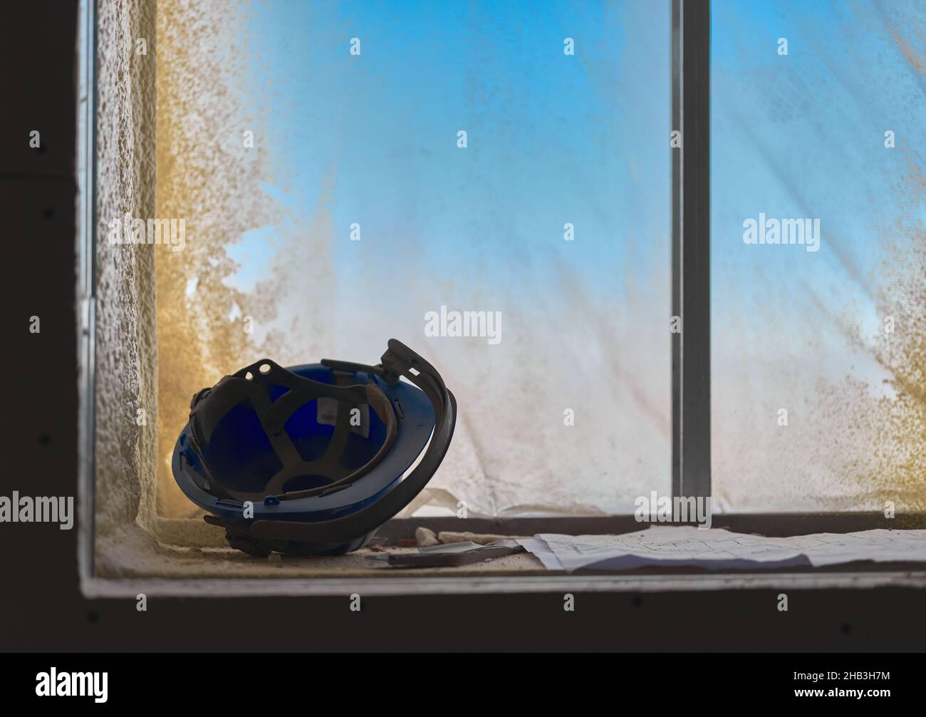 detail of a protective helmet over a window at a construction site ...