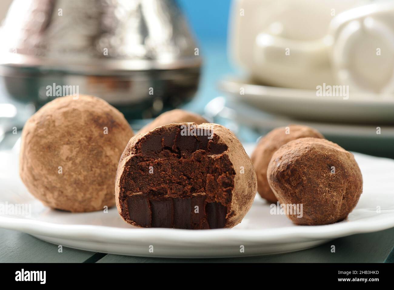 Homemade chocolate candies on turquoise background closeup Stock Photo ...