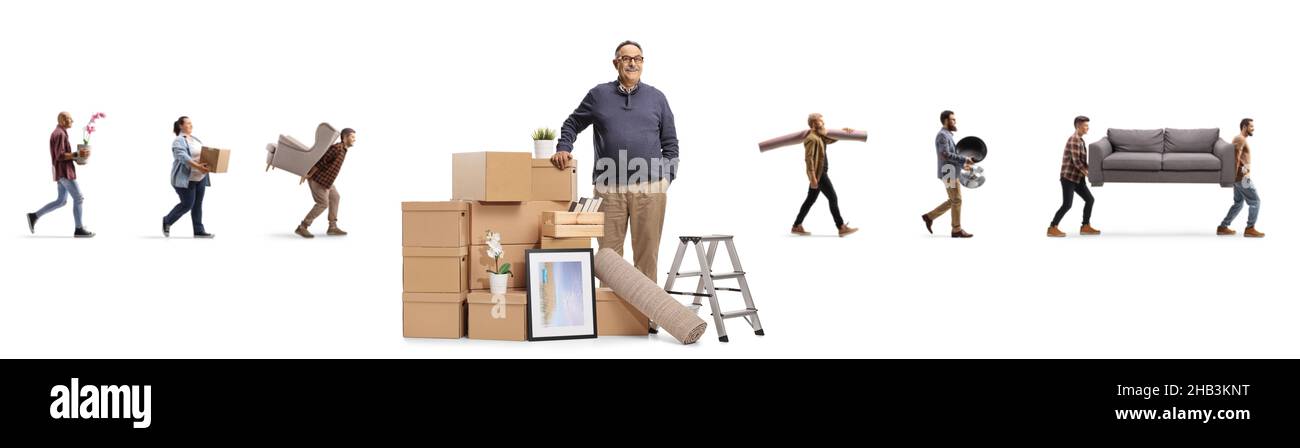 Man with cardboard boxes and other people behind carrying household ...
