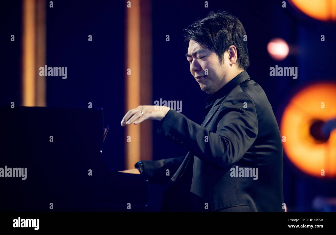 Leipzig, Germany. 16th Dec, 2021. Chinese pianist Lang Lang sits on ...