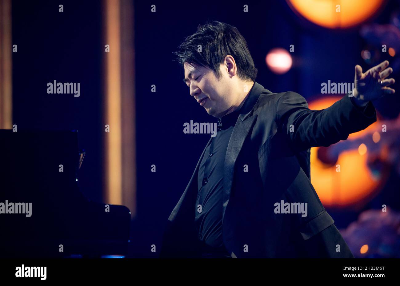Leipzig, Germany. 16th Dec, 2021. Chinese pianist Lang Lang sits on ...