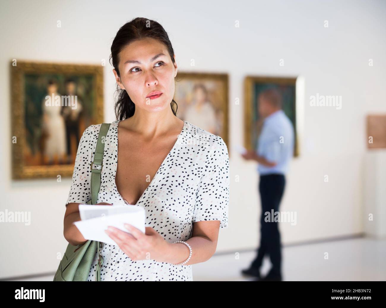 woman admiring art work Stock Photo - Alamy
