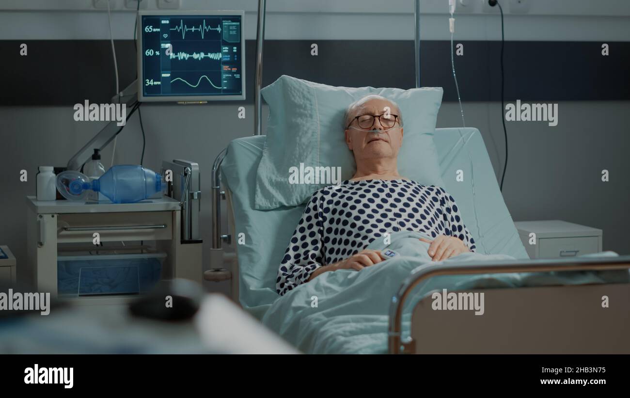 Hospital ward patient sleeping in bed at medical unit connected to ...