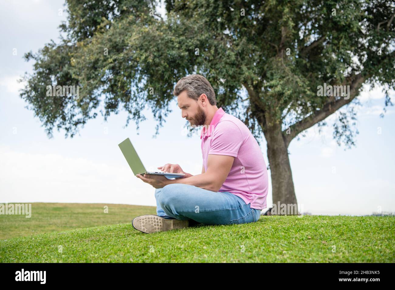 modern business computer communication. mature guy check email ...