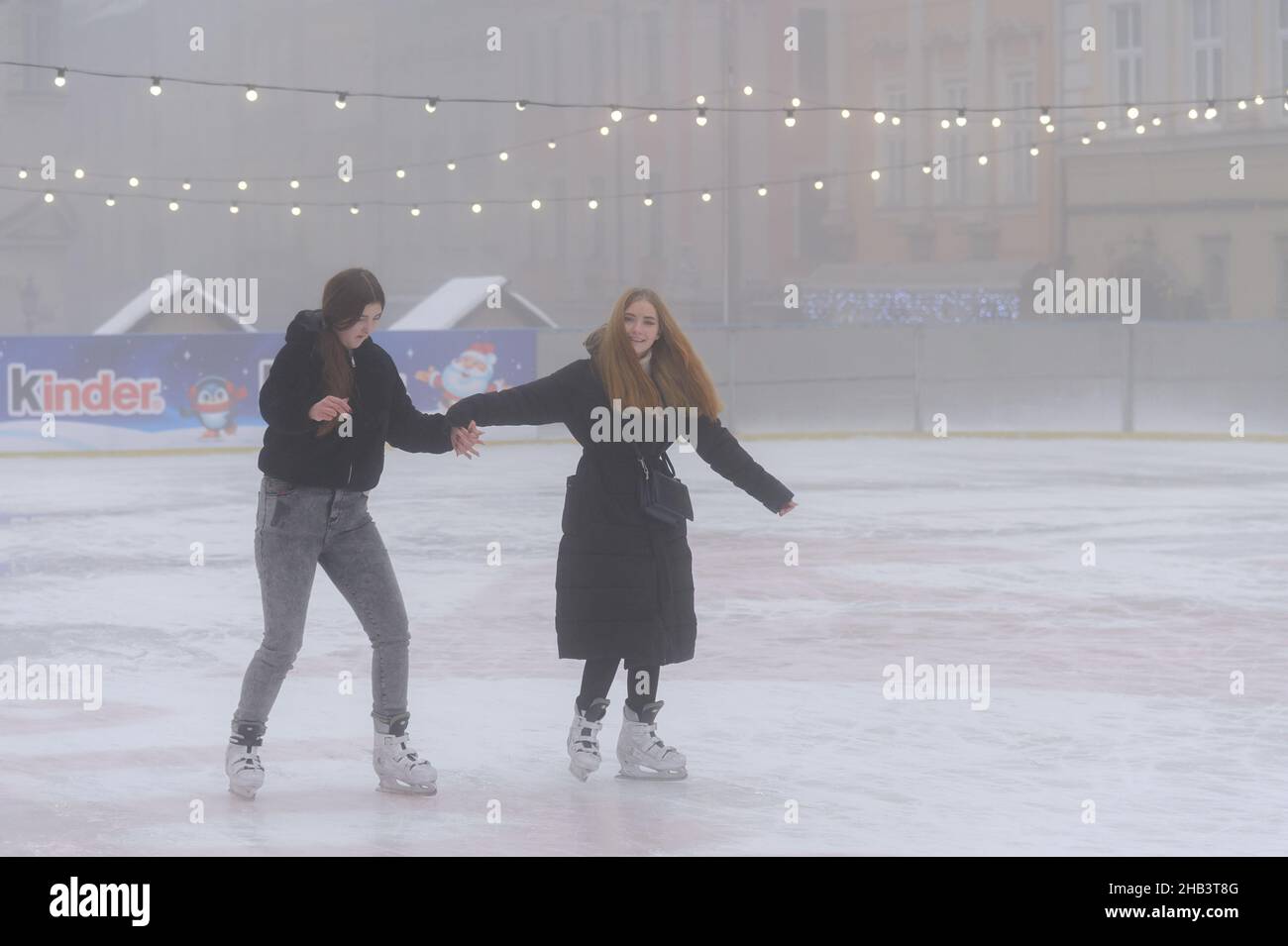 Lviv, Ukraine. 16th Dec, 2021. Girls are seen ice skating in downtown ...