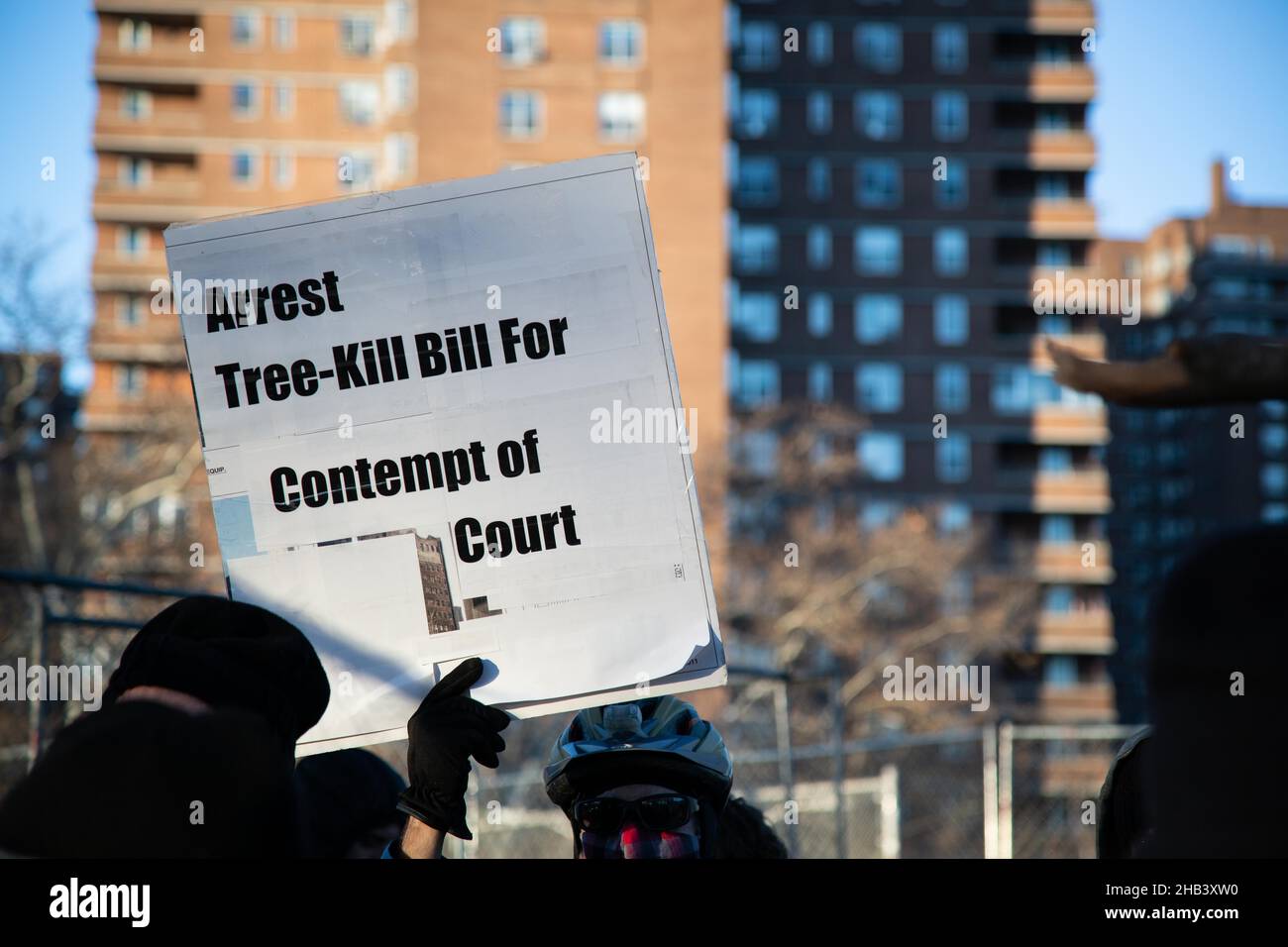 New York, USA. 12th Dec, 2021. A placard reads, ''Arrest tree kill bill ...