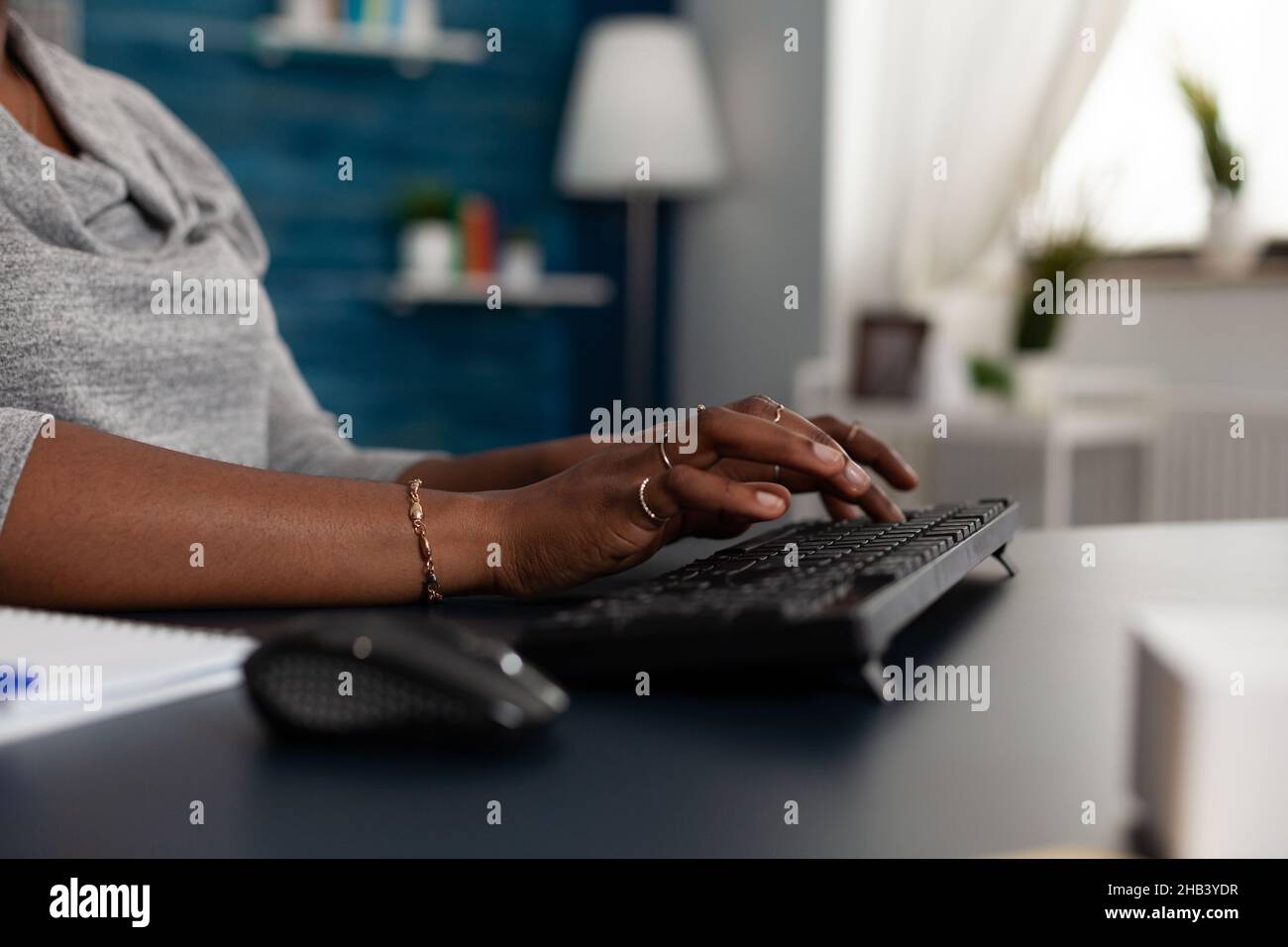 Close up of hands typing on keyboard to work on business project with ...