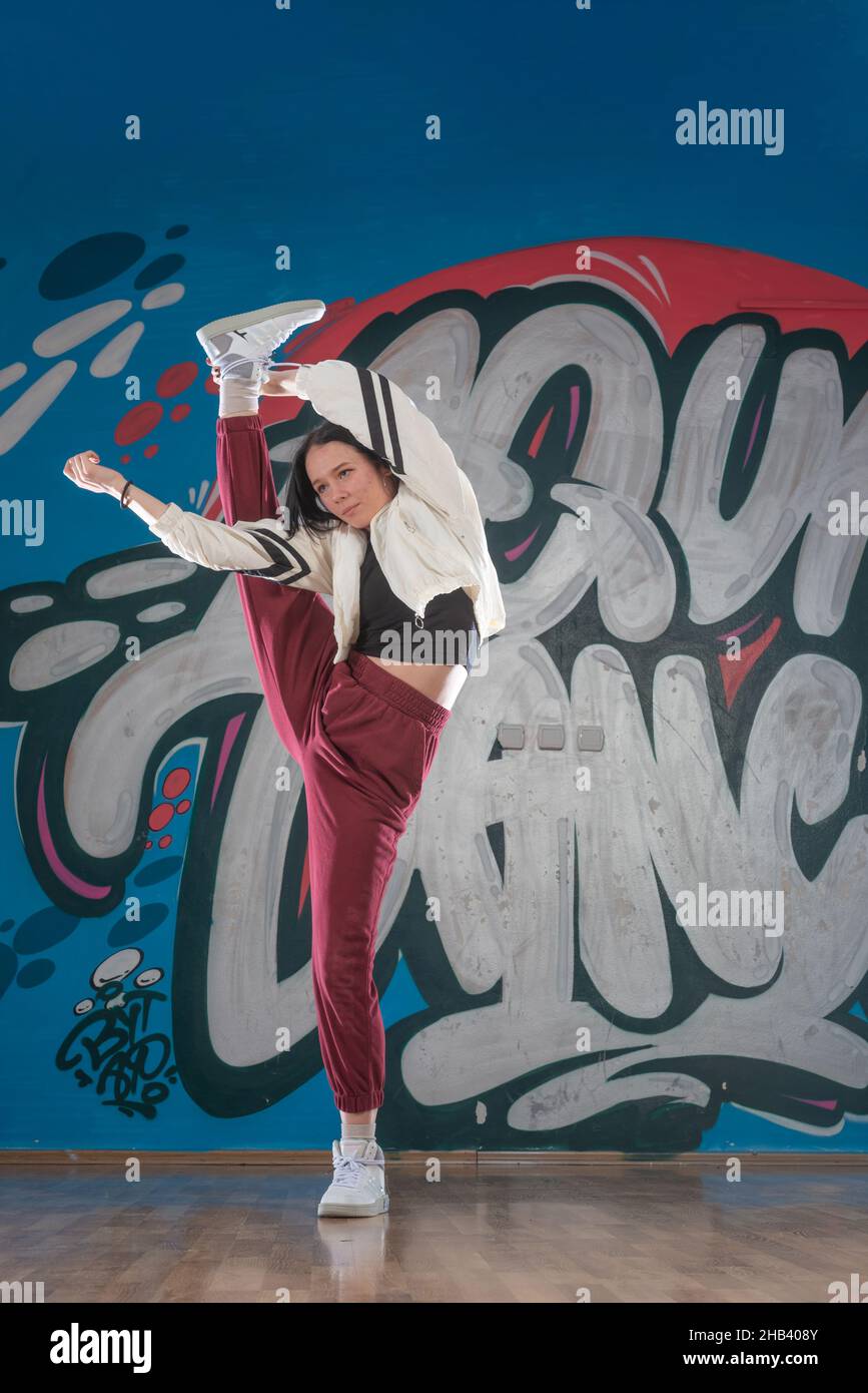 young and beautiful dancer posing on studio background Stock Photo - Alamy