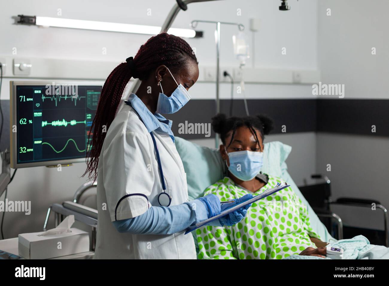 African american practitioner doctor wearing medical protective face ...