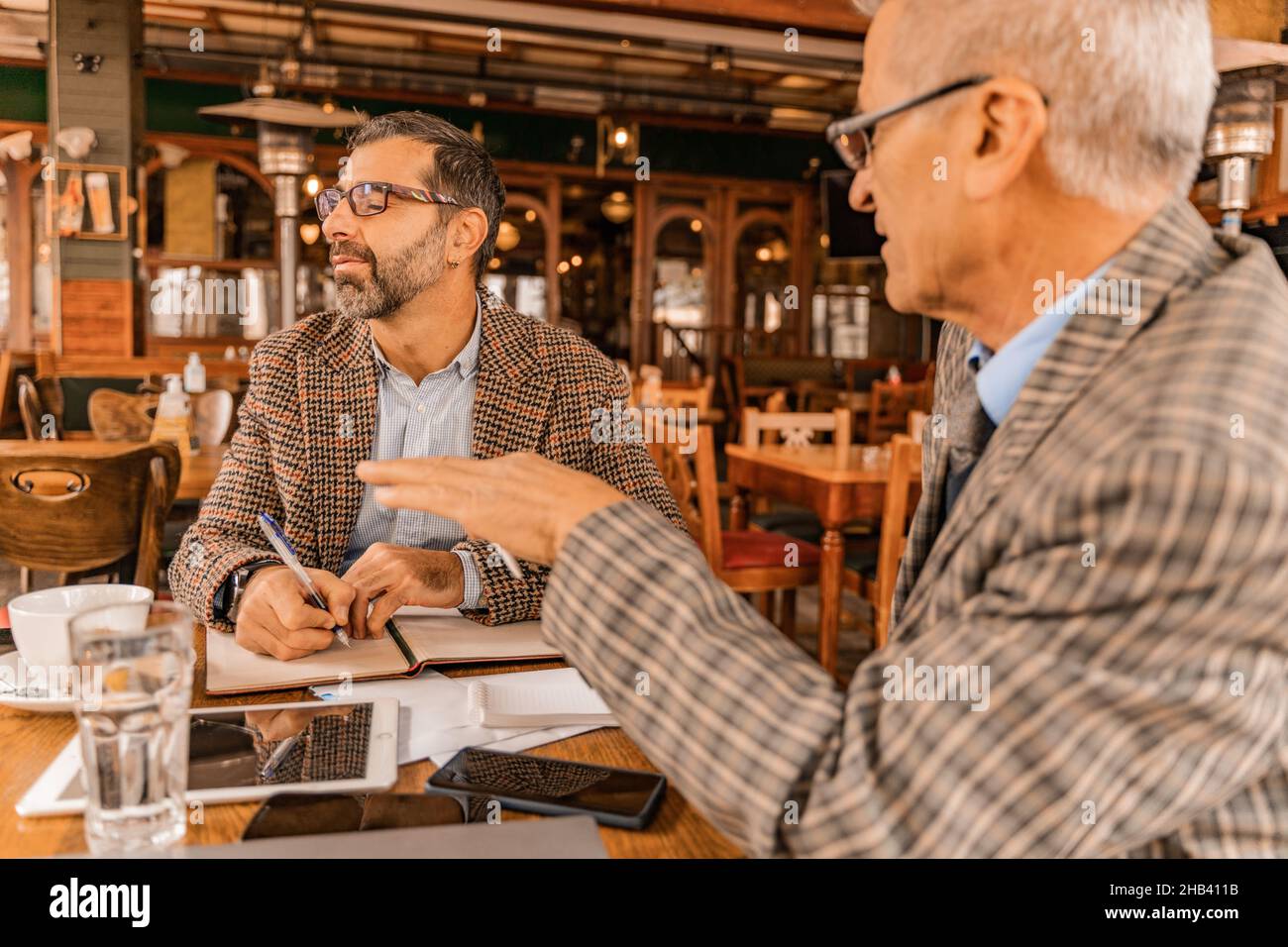 Two senior and businessmen are making the new plans together and ...