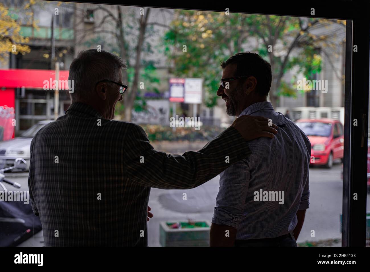 Two senior businessmen are acknowledge each other, silhouette Stock ...