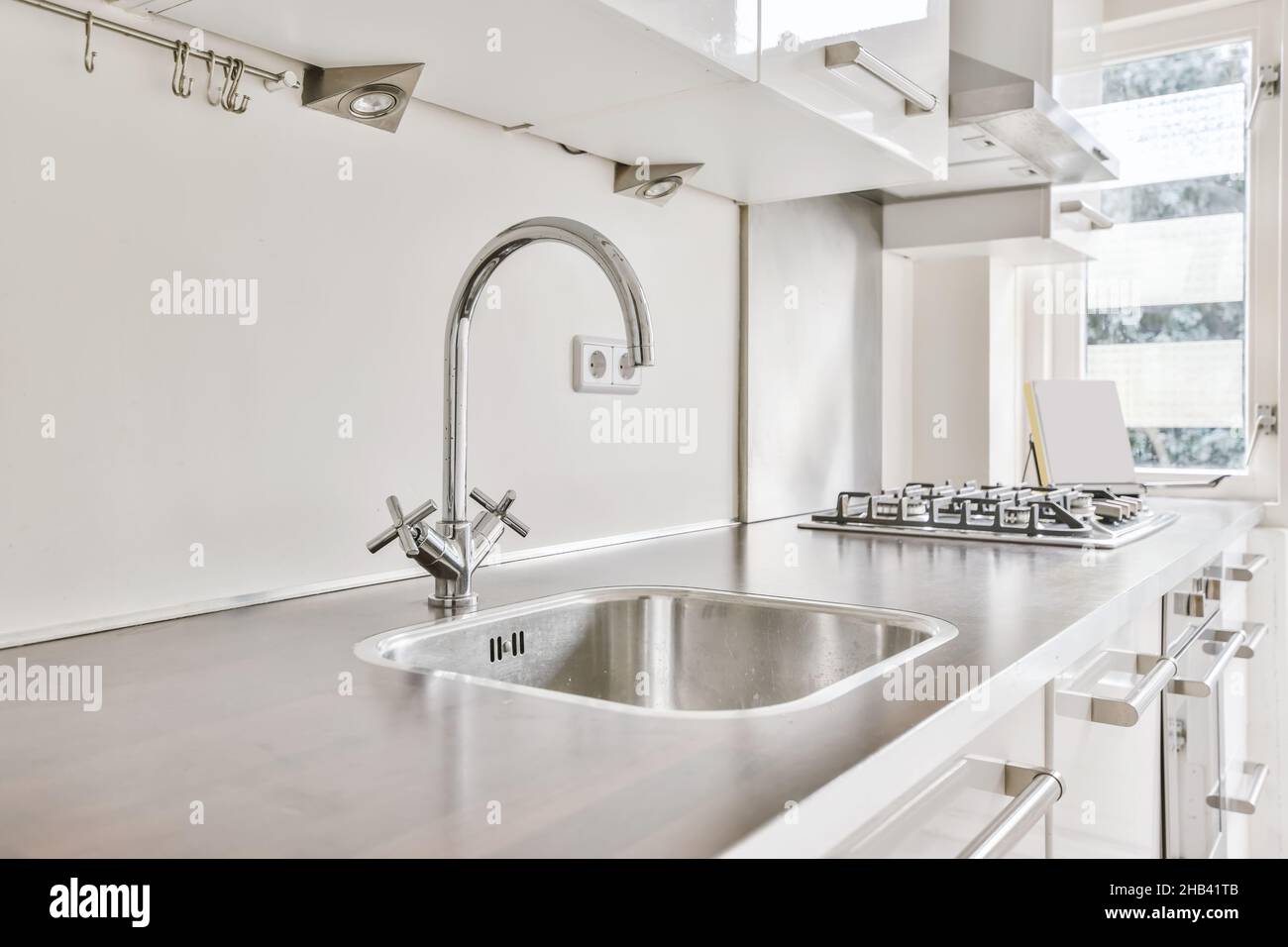 Superior kitchen design with wood worktop and white kitchen unit Stock ...